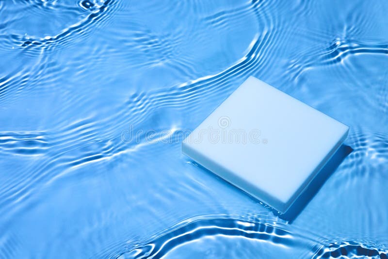 Two Empty Square Podiums on Transparent Blue Water Background Stock ...