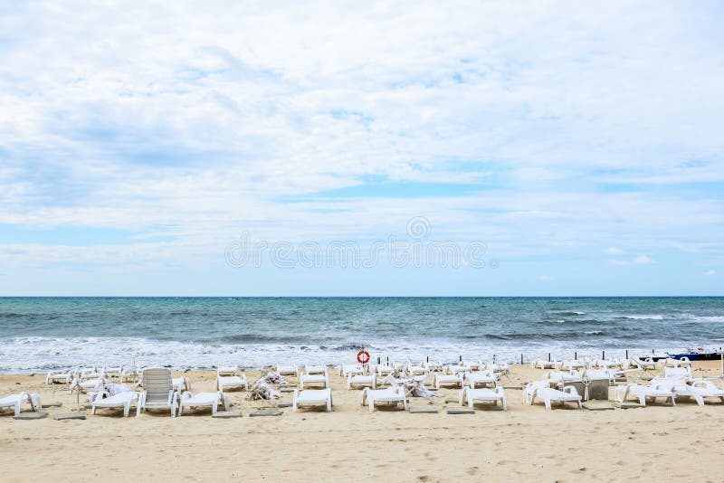 Empty White Sun Loungers on the Sandy Sea Beach Stock Photo - Image of ...