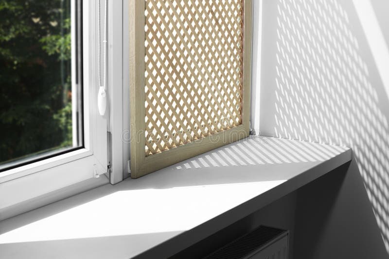 Empty White Window Sill and Decorative Wooden Shutter Indoors Stock ...