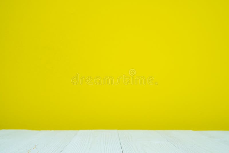 Empty White Wooden Table with Yellow Wall Background Stock Photo ...