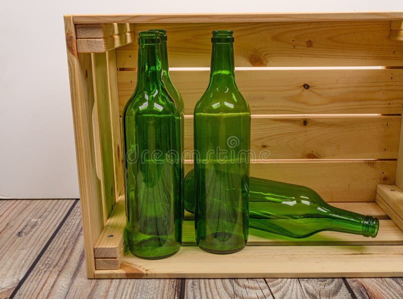 Empty Wine Bottles in a Wooden Box on the Table. Home Winemaking Stock ...