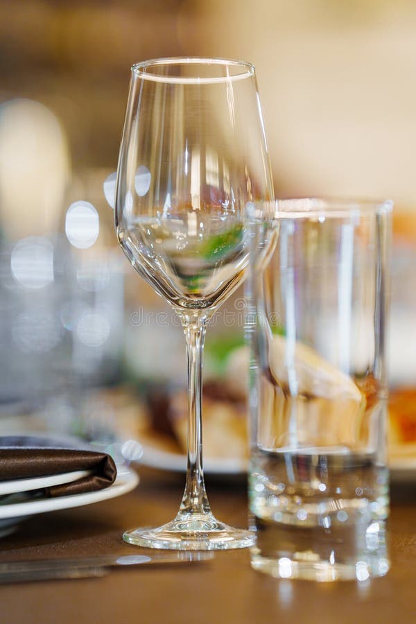 An Empty Wine Glass and a Glass on the Served Dining Table. Stock Image ...