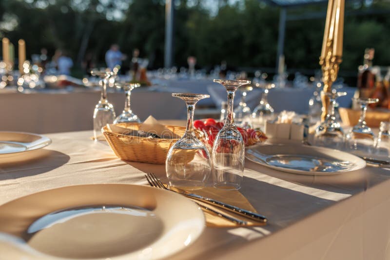 Empty Wine Glasses on Banquet Served Table in Open Air in Rays of ...