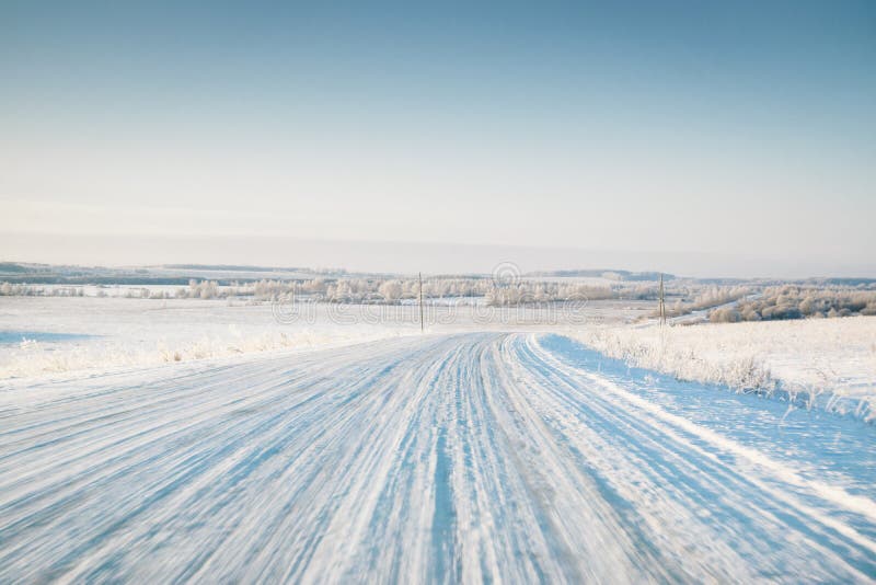 Empty Winter Road Covered with Snow on Field in Motion Stock Photo ...