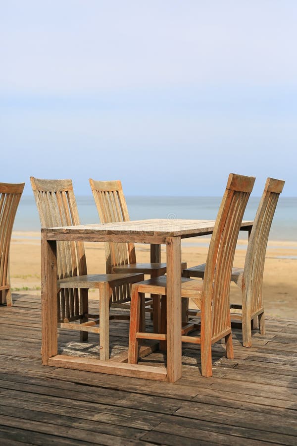 Empty Wood Table and Chairs at Restaurants Near the Beach Stock Photo ...