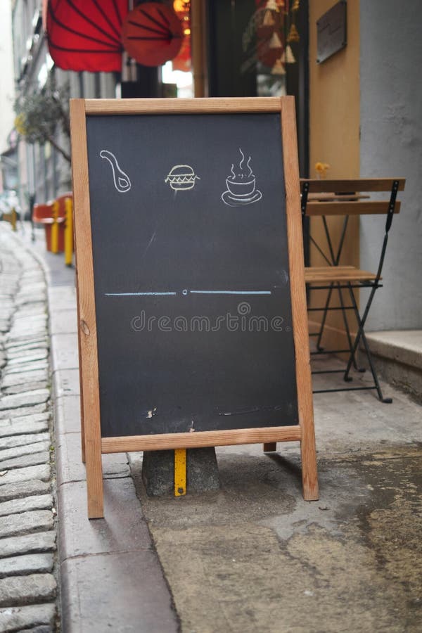 Empty Wooden Blackboard Mockup Standing Outdoors in Front of Cafe Stock ...