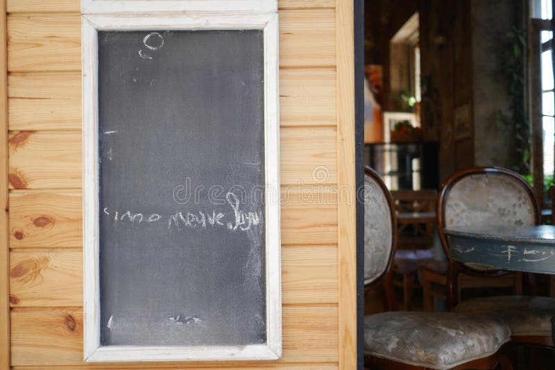 Empty Wooden Blackboard Mockup Standing Outdoors in Front of Cafe Stock ...