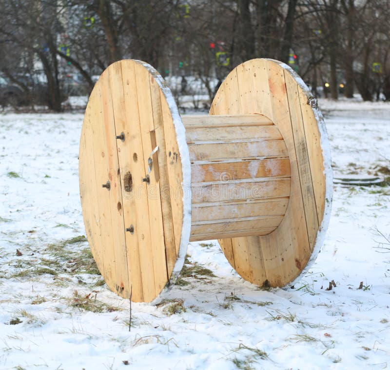 An Empty Wooden Cable Reel Stands in the Snow Stock Photo - Image of ...