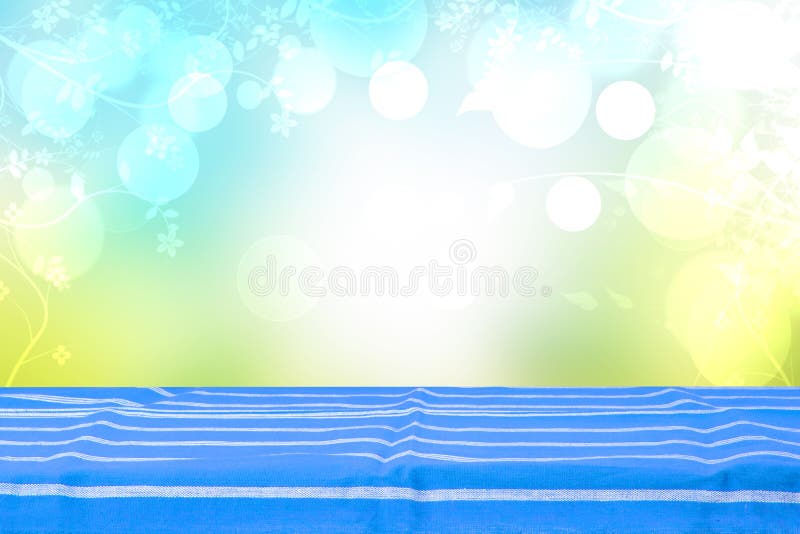 Empty Wooden Deck Table with Blue Striped Tablecloth Over Abstract ...