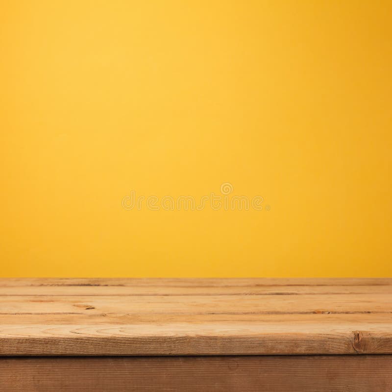 Empty Wooden Deck Table Over Yellow Wallpaper Stock Image - Image of ...