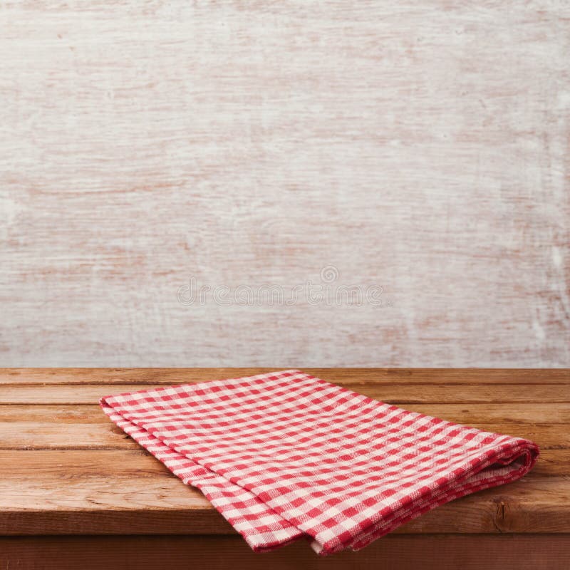 Empty Wooden Deck Table with Red Checked Tablecloth Over Rustic Wall ...