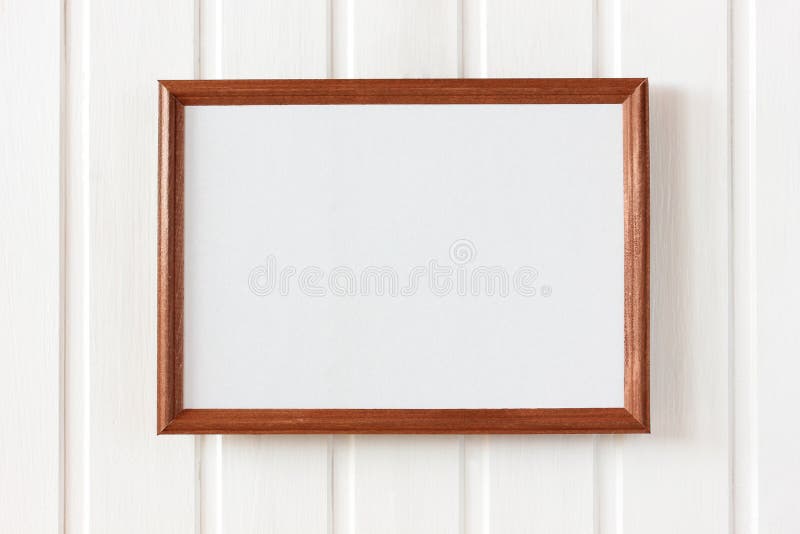 Empty Wooden Frame Hanging on a White Wall Stock Photo - Image of ...