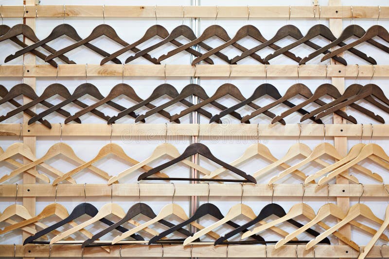 Empty wooden hangers stock photo. Image of fashion, rail - 114772650