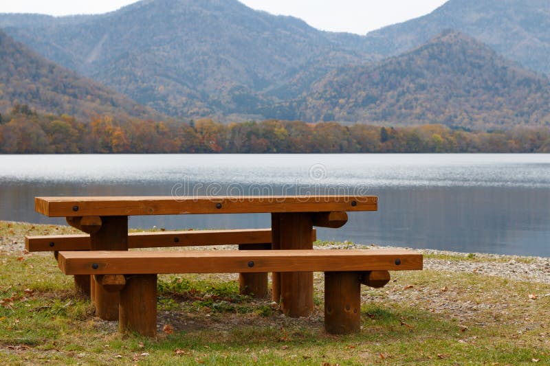 Empty Wooden Picnic Table by a Lake Stock Image - Image of outdoors ...