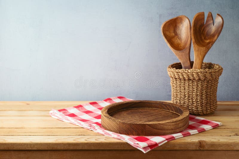 Empty Wooden Plate and Kitchen Utensils on Table. Kitchen Interior ...