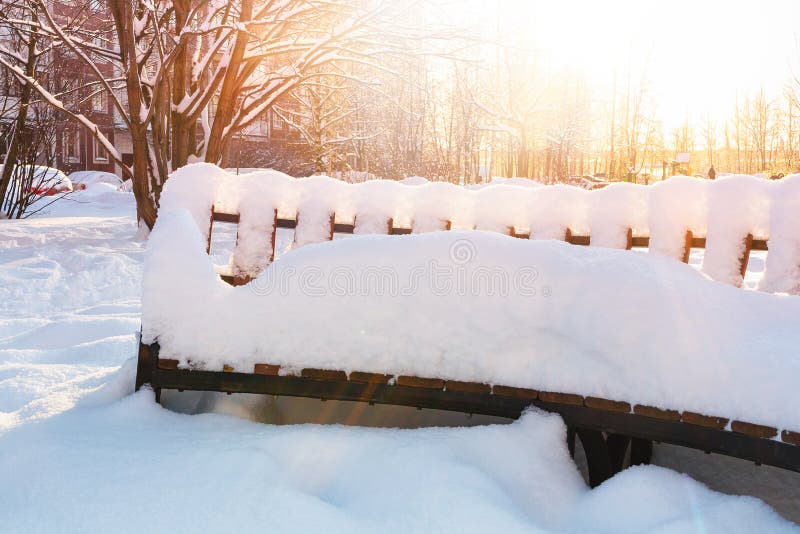 Empty Wooden Snow Covered Bench in the Town Square Stock Image - Image ...