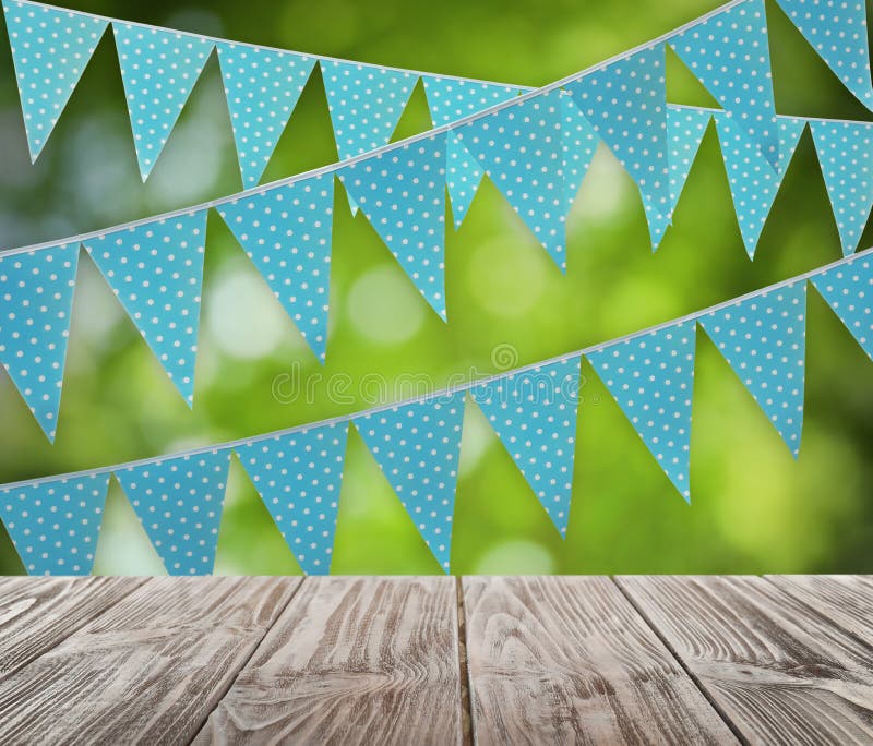 Empty Wooden Table and Decorative Bunting Flags Outdoors Stock Image ...