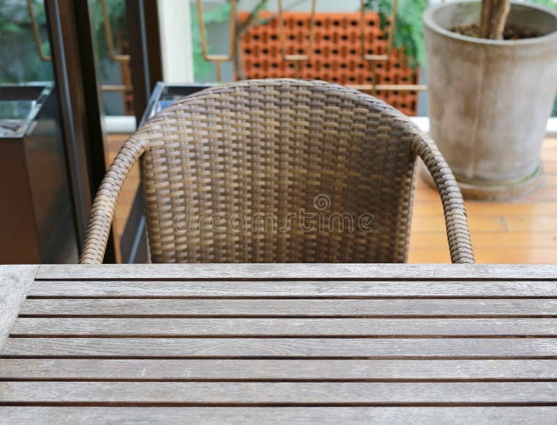 Empty Wooden Table and Rattan Chair in the Restaurant Stock Photo ...