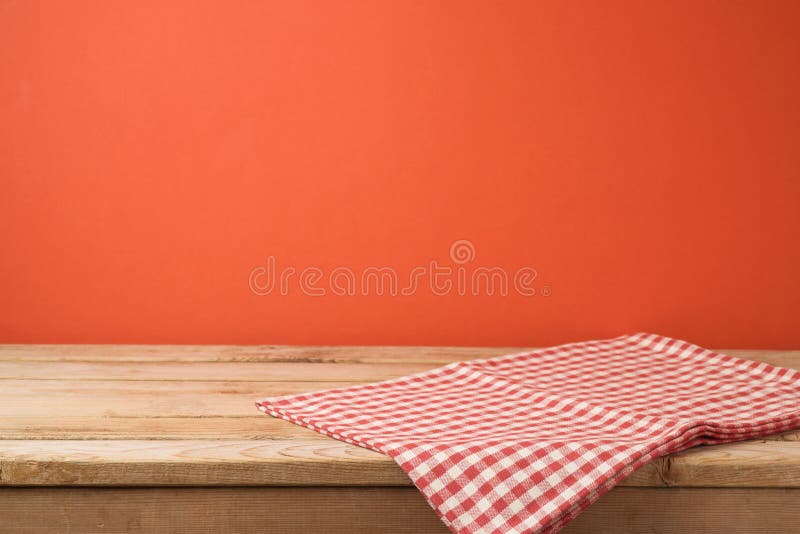 Empty Wooden Table with Red Checked Tablecloth Over Red Wall Background ...