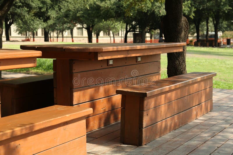 Empty Wooden Tables with Benches in Park Stock Photo - Image of grass ...