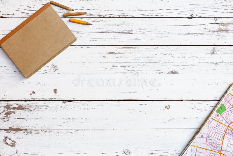 Empty Wooden Traveller`s Table with Notebook and Map, Top View Stock ...