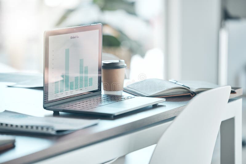 Empty Workplace with Laptop, Notebook and Coffee on a Desk in a Modern ...