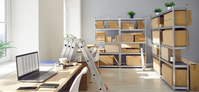 Empty Workplace with Office Desk and Laptop in Warehouse with Shelves ...