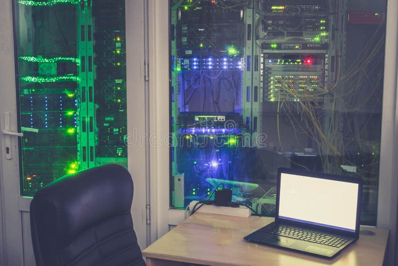 Empty Workplace of the System Administrator is in the Server Room. Many ...