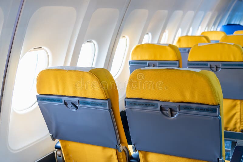 Empty Yellow Color Airplane Seat with Airplane Window Stock Image ...