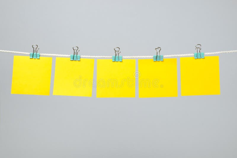 Empty Yellow Paper Notes Hanging on the String Stock Photo - Image of ...