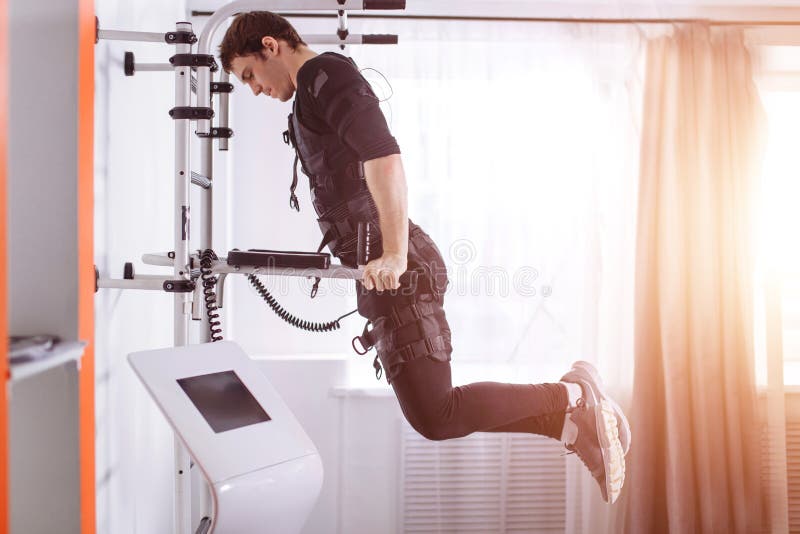 EMS Male Working Out, Doing Push Ups. Man Doing Triceps Dips on ...