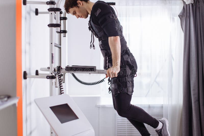 EMS Male Working Out, Doing Push Ups. Man Doing Triceps Dips on ...