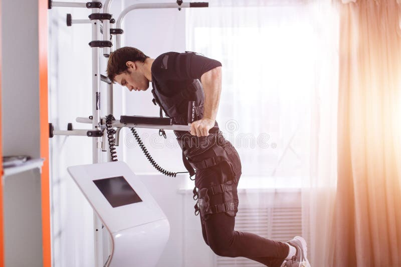 EMS Male Working Out, Doing Push Ups. Man Doing Triceps Dips on ...