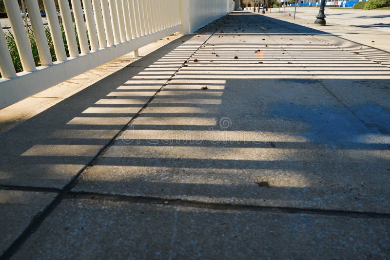 Enclosure and Shadows on the Ground of Footpath in the City Stock Image ...