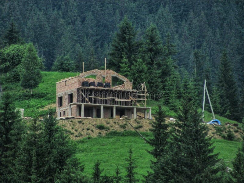 Encroachment on Wilderness: House Construction in Forest Stock Photo ...