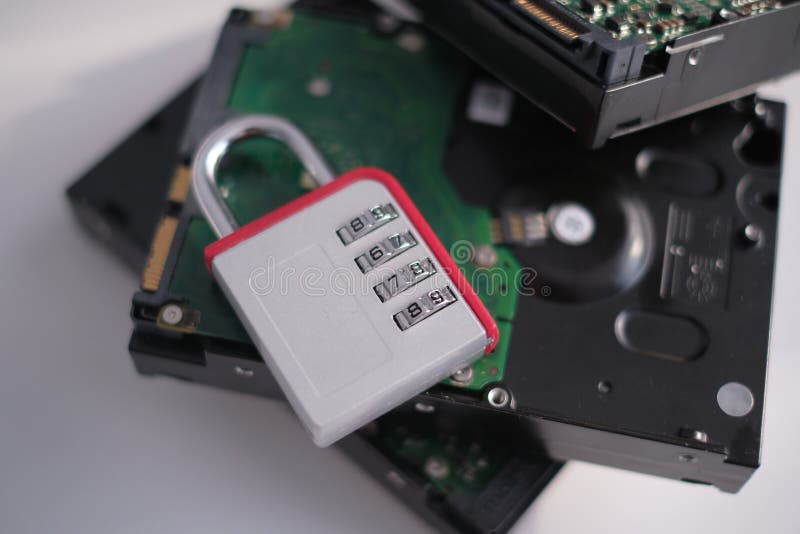 Encrypted Hard Disk. Padlock with Cipher on an Opened Hard Disk. Data ...
