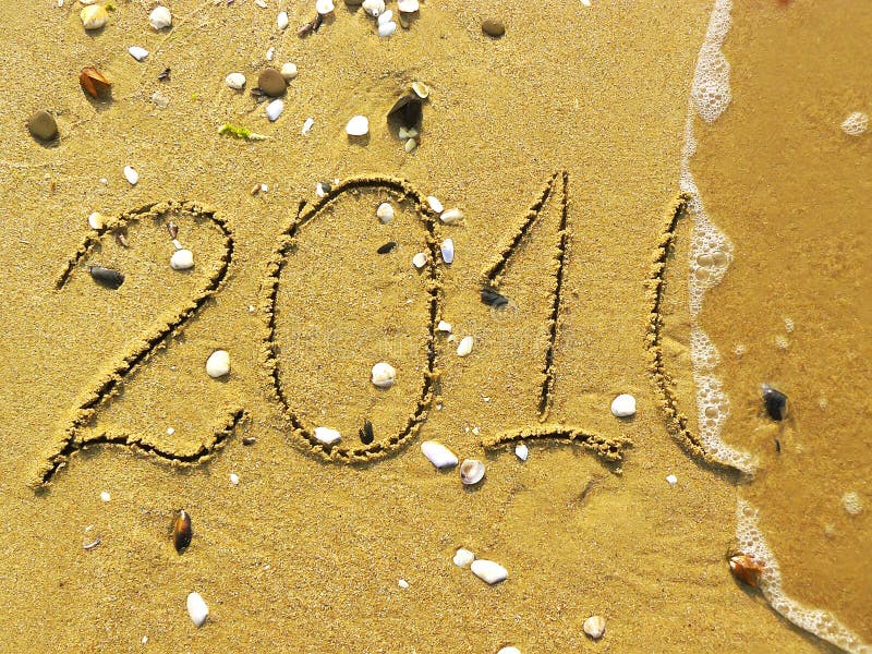 End of 2010 on the beach stock photo. Image of light - 16341520