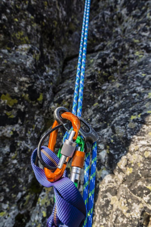 Rappel Down on the Climbing Rope Using a Descender. Stock Image - Image ...