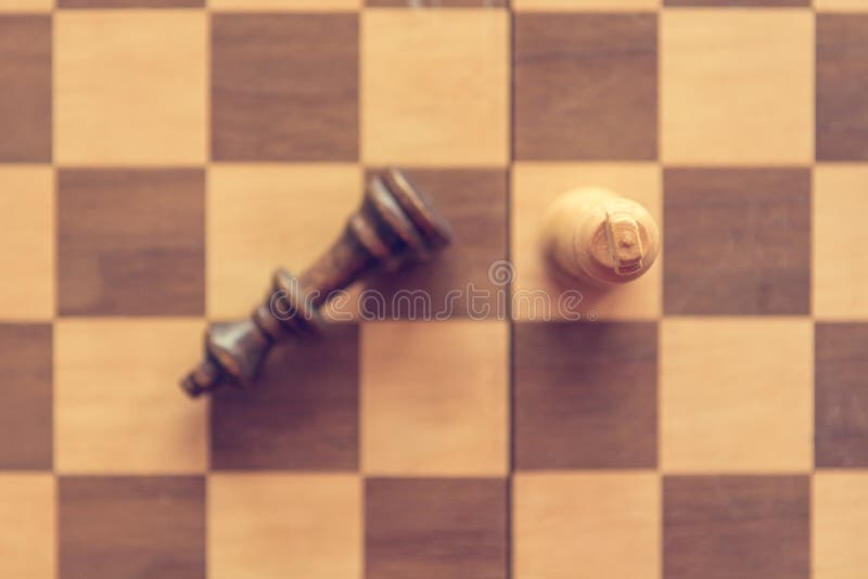 End Game of Chess with One Fallen King Figure. Stock Photo - Image of ...