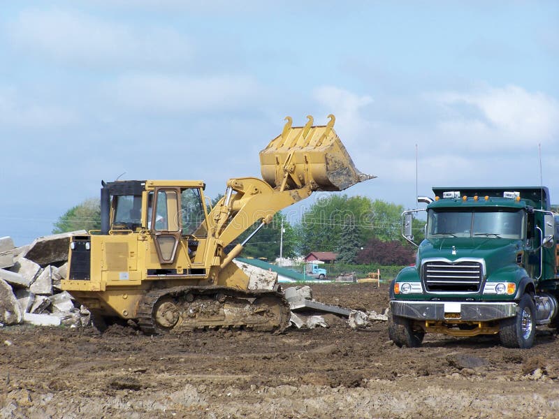End Loader Loading Dirt into Dump Truck Stock Photo - Image of dozer ...