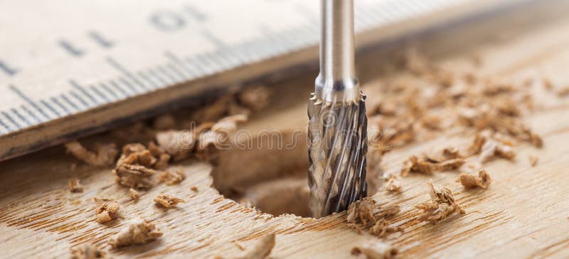 End Mill Makes a Hole in the Wooden Oak Table with Wood Stock Photo ...