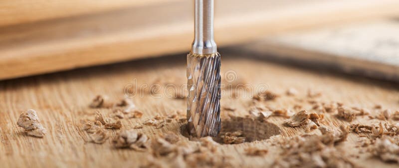 End Mill Makes a Hole in the Wooden Oak Table with Wood Stock Photo ...