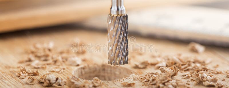 End Mill Makes a Hole in the Wooden Oak Table with Wood Stock Image ...