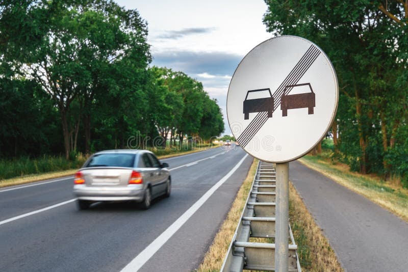 End of No Overtaking Road Sign and Car in Motion Stock Photo - Image of ...