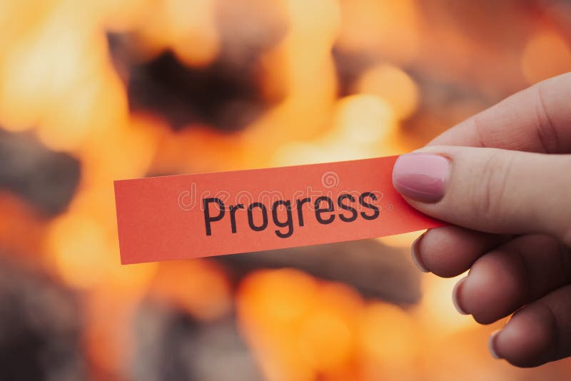 Red Paper with Inscription Progress Near Bonfire Stock Photo - Image of ...