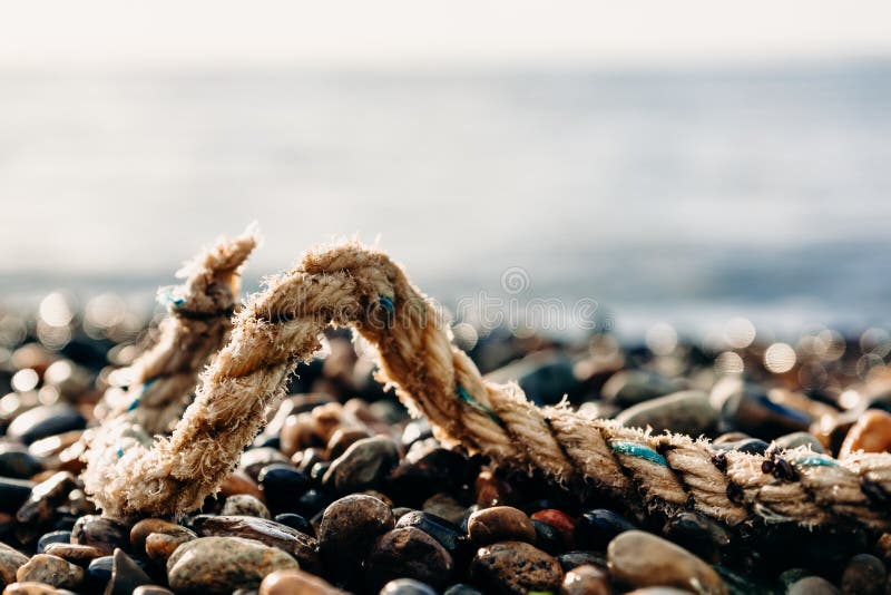 The End of the Rope Lies on a Stone Sea Beach Stock Photo - Image of ...