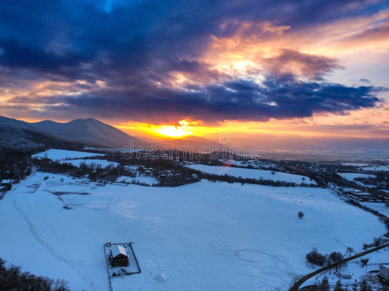 The End of a Snowy Day and a Beautiful Sunset Over the House Stock ...