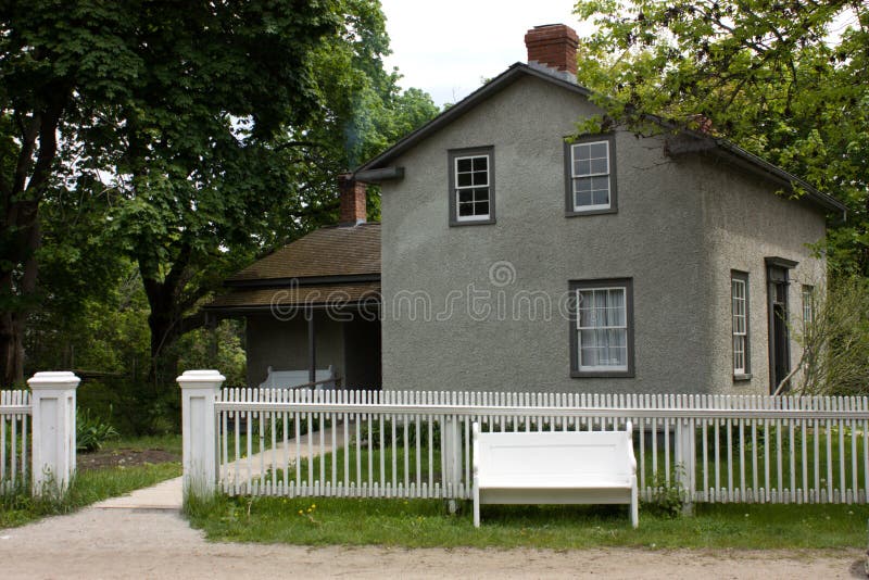 End View of a Beautiful Cottage Stock Photo - Image of fence, green ...