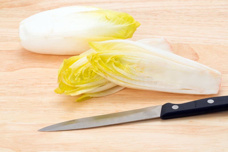 Endives on a Wooden Cutting Board Stock Photo - Image of cutting ...