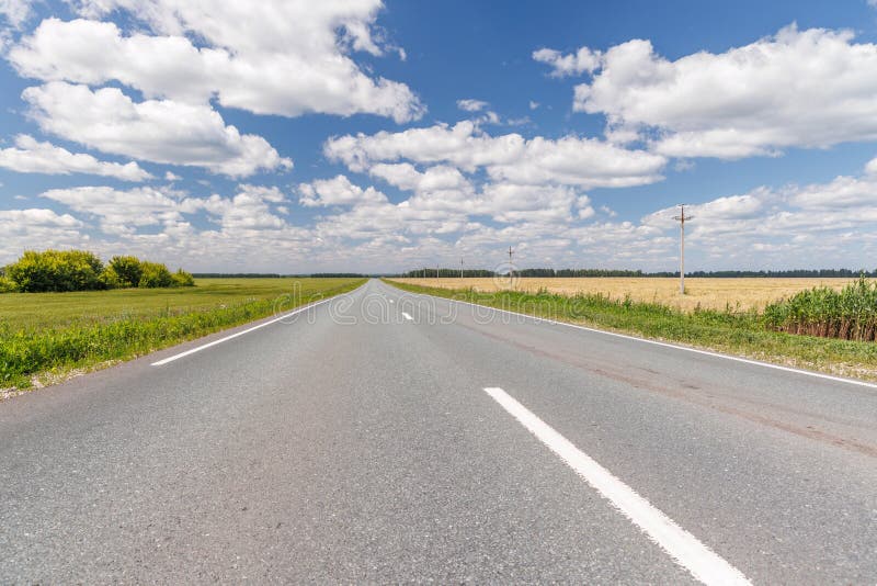 Endless Asphalt Road Stretching through a Summer Landscape of Green ...